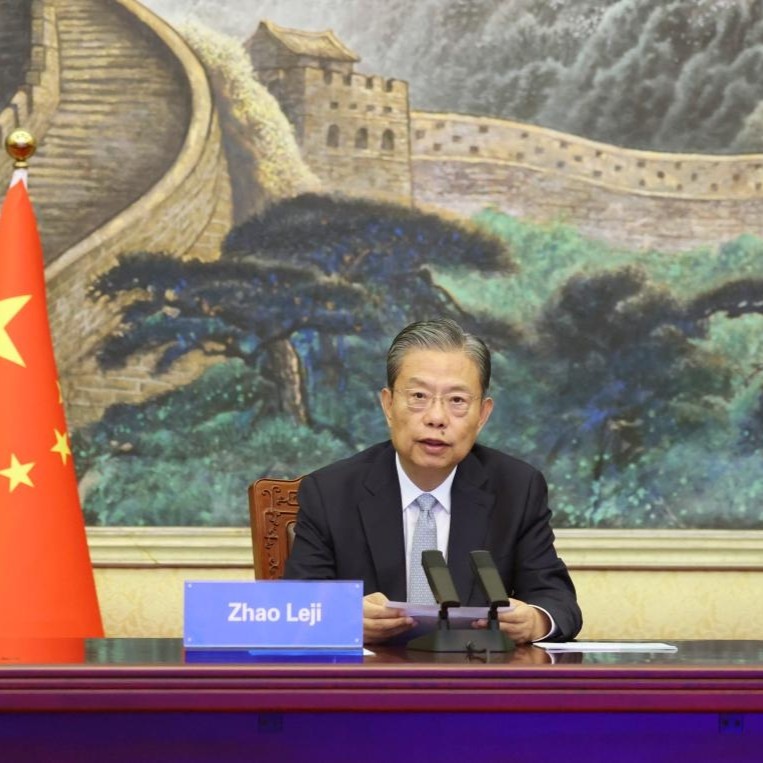 China's top legislator attends symposium with lawmakers